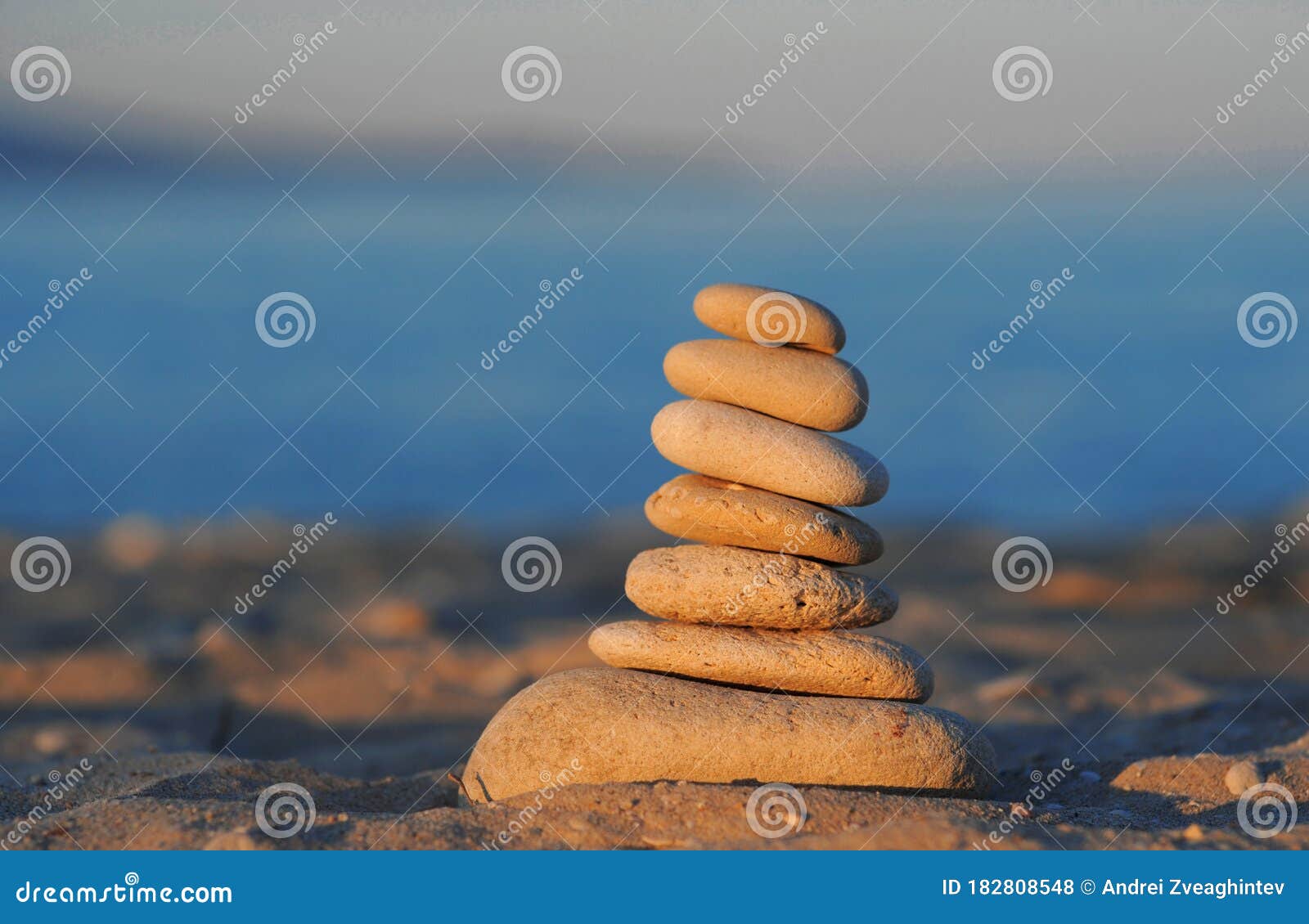 Stone pyramid on beach stock photo. Image of outdoors - 182808548