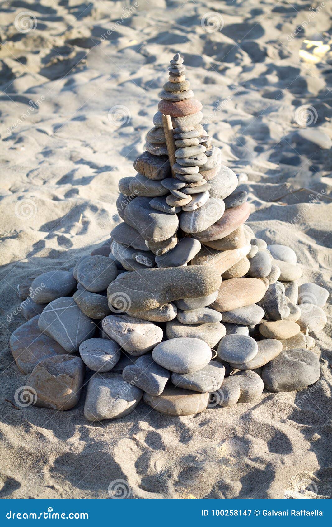 Stone pyramid on the sand stock image. Image of material - 100258147
