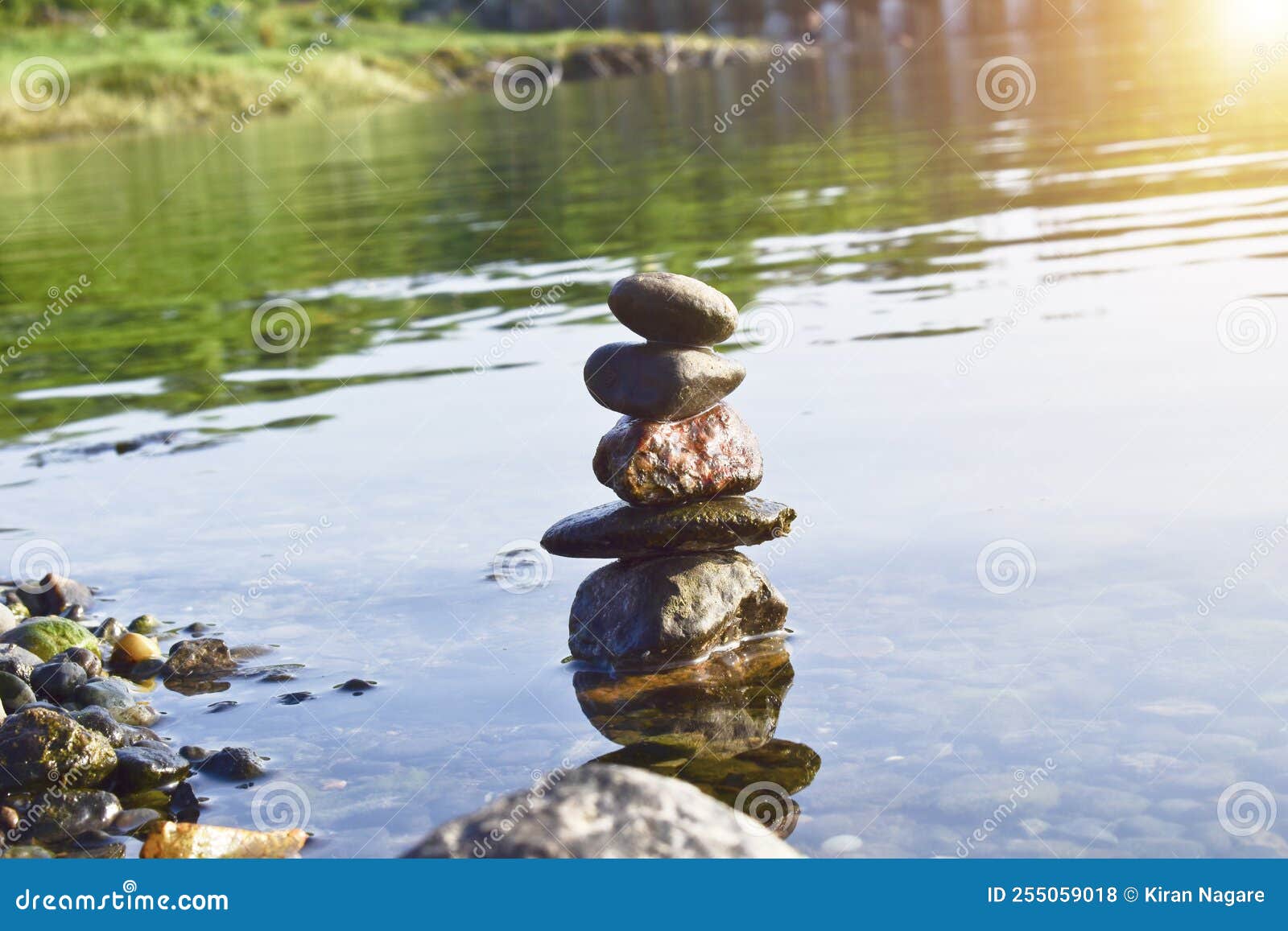 A Stone Pyramid in the Water by the River Stock Photo - Image of close ...