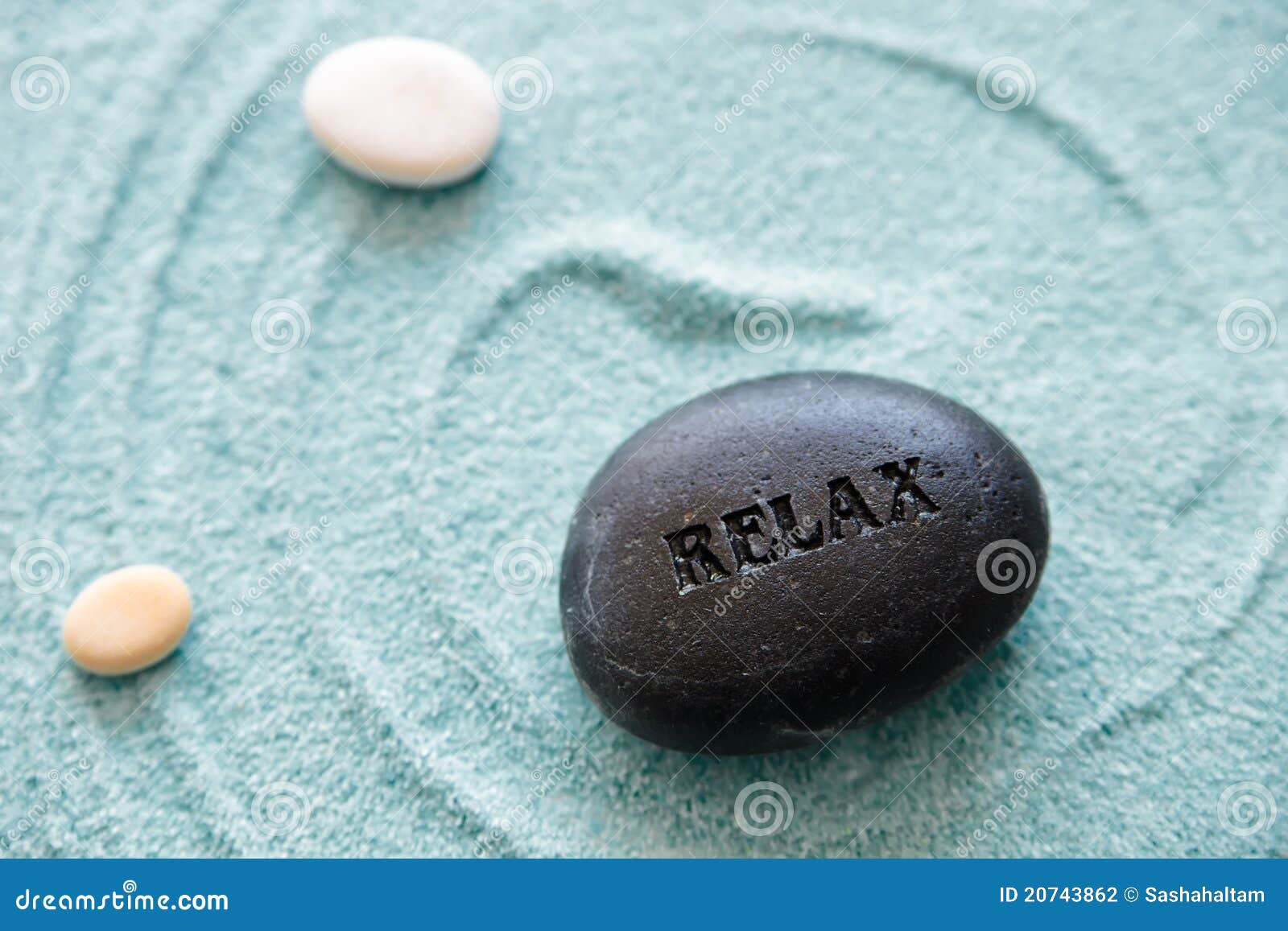 Stone Relax on a blue sand stock photo. Image of calmness - 20743862