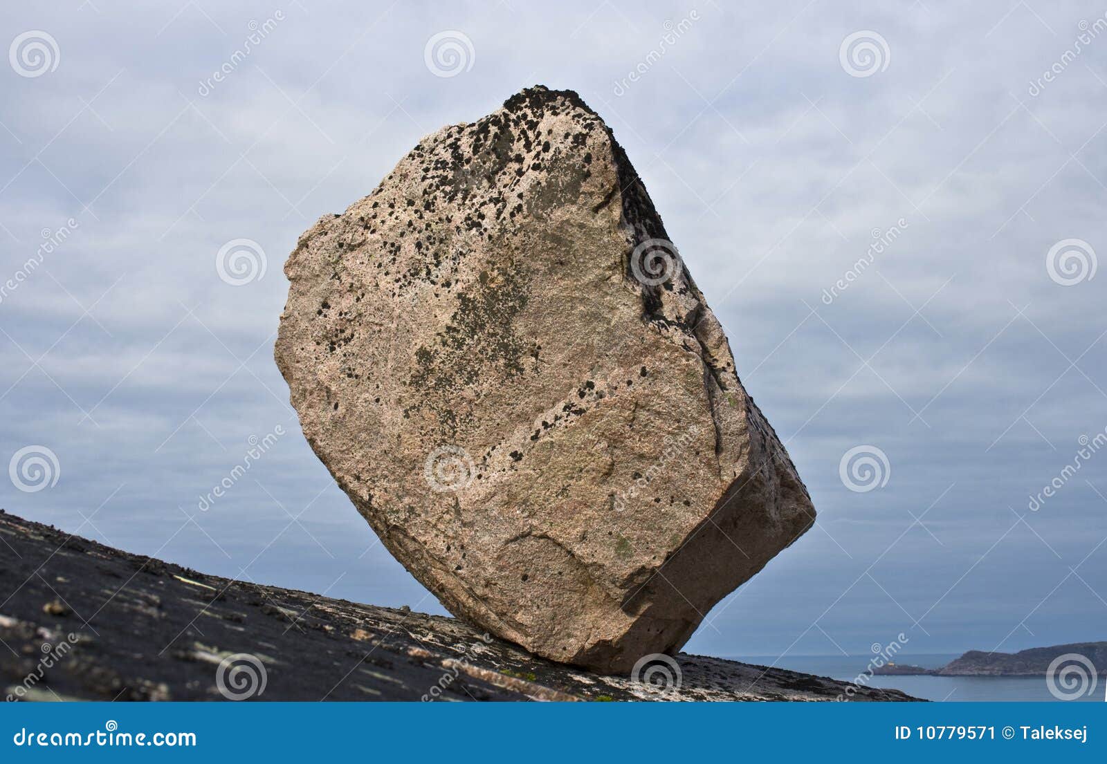 Stone on rocky slope stock image. Image of instability - 10779571