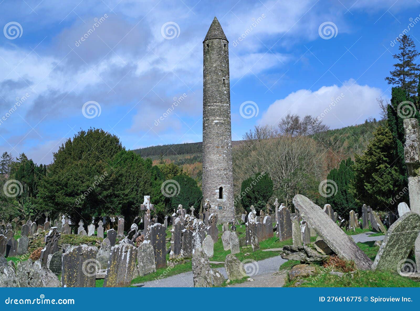 Stone Round Tower And Some Ruins Of A Monastic Settlement Originally ...