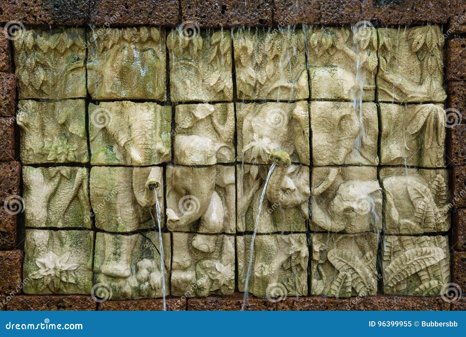 Stone Sculpture of Elephant on Brick Wall with Waterfall. Stock Image ...