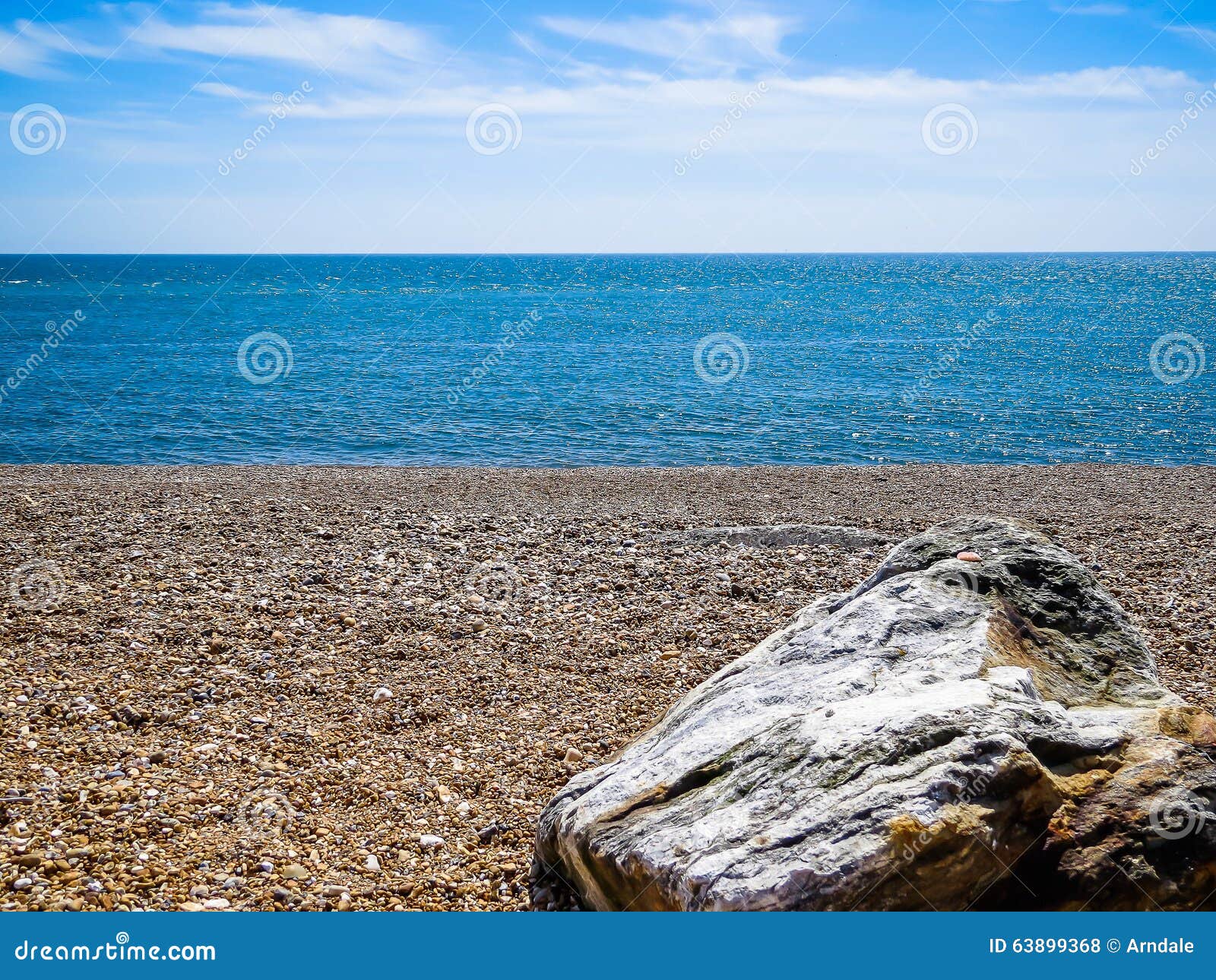 Stone on the sea coast stock photo. Image of pebble, blue - 63899368