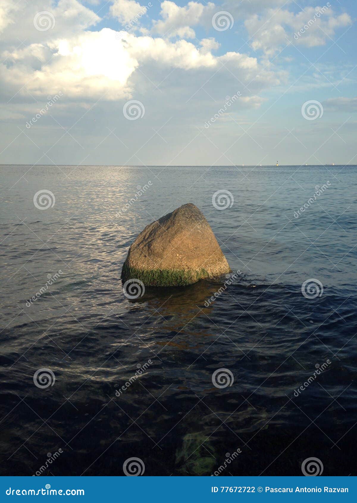 Stone in the sea stock photo. Image of rock, stone, middle - 77672722