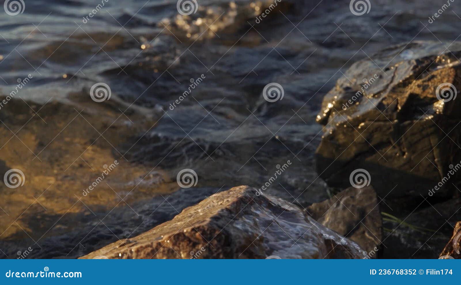 Stone Shore of the Lake. Waves Wash Over the Pebbles Stock Footage ...
