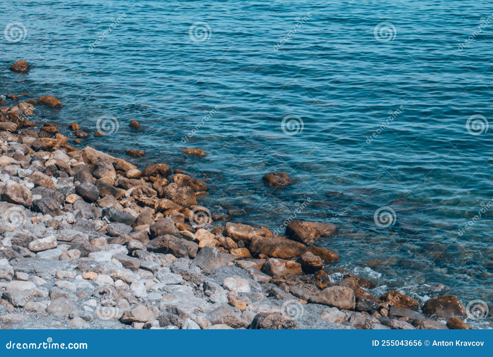 The Stone Shore is Washed by the Turquoise Sea. Stock Photo - Image of ...