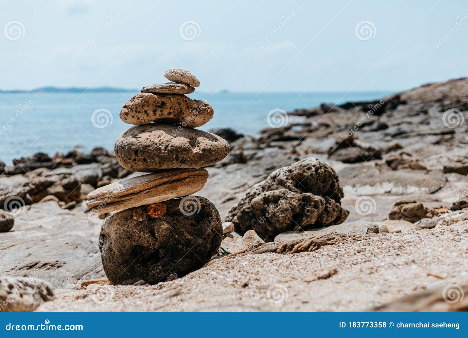 Stone stack on the beach stock photo. Image of stability - 183773358