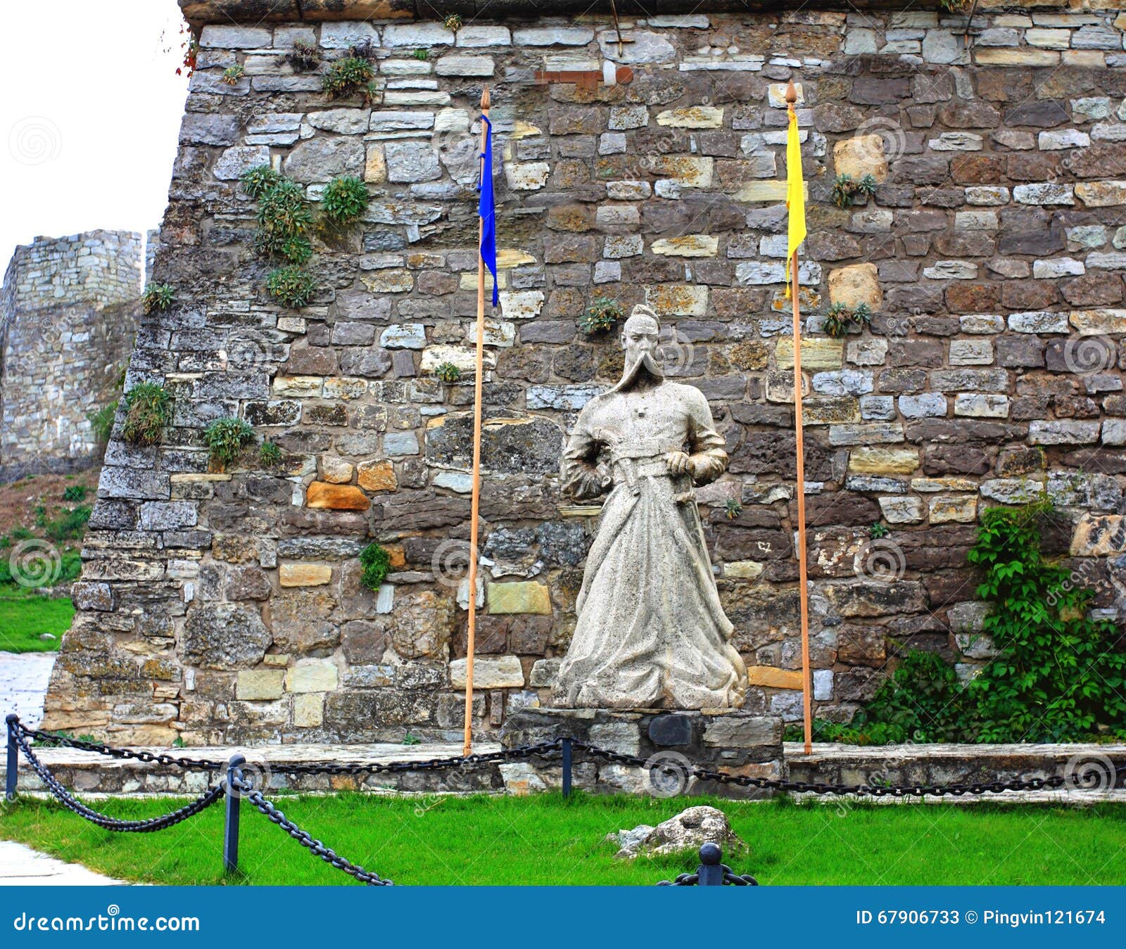 Stone Statue in the Background of an Ancient Wall Stock Image - Image ...