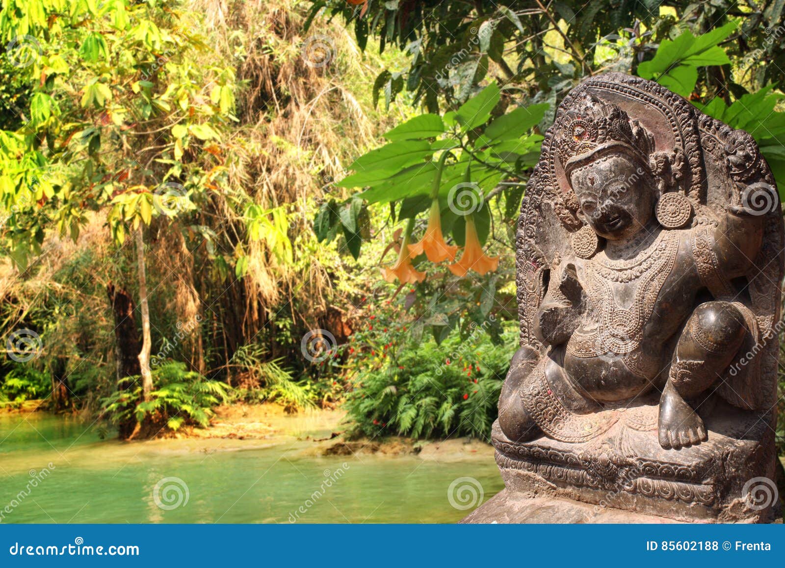 Stone Statue of Dancing Hindu God and Trees in Rainforest Stock Photo ...
