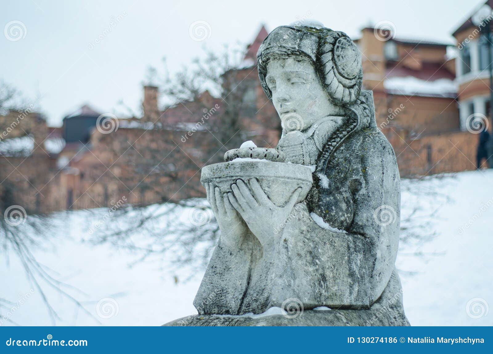 Stone Statue in Winter Under the Snow. City Details. Stock Photo ...