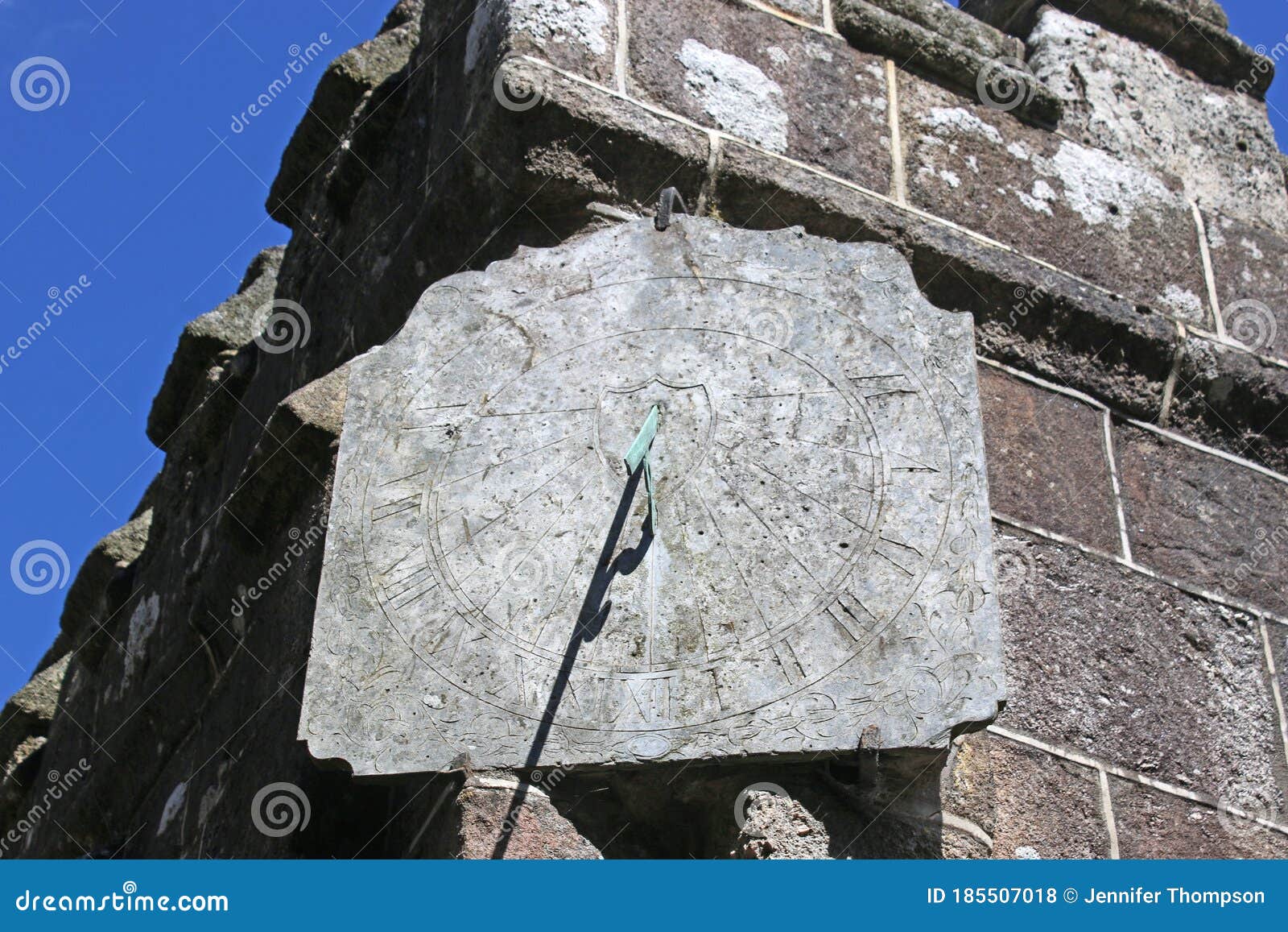 Stone sundial on a wall stock photo. Image of exterior - 185507018