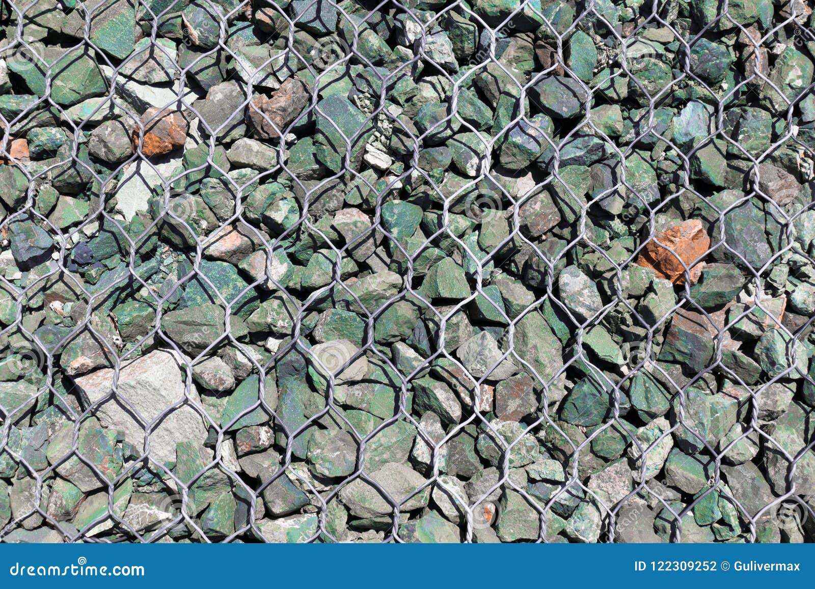 Background from Stones and Pebbles in Wire Mesh Stock Photo - Image of ...