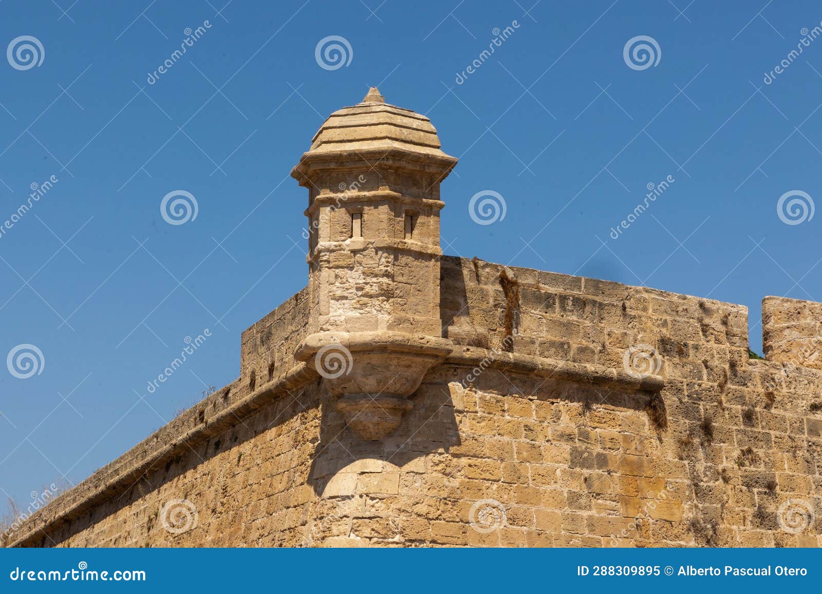 Stone Turret on a Wall Against the Blue Sky on a Sunny Day Stock Image ...