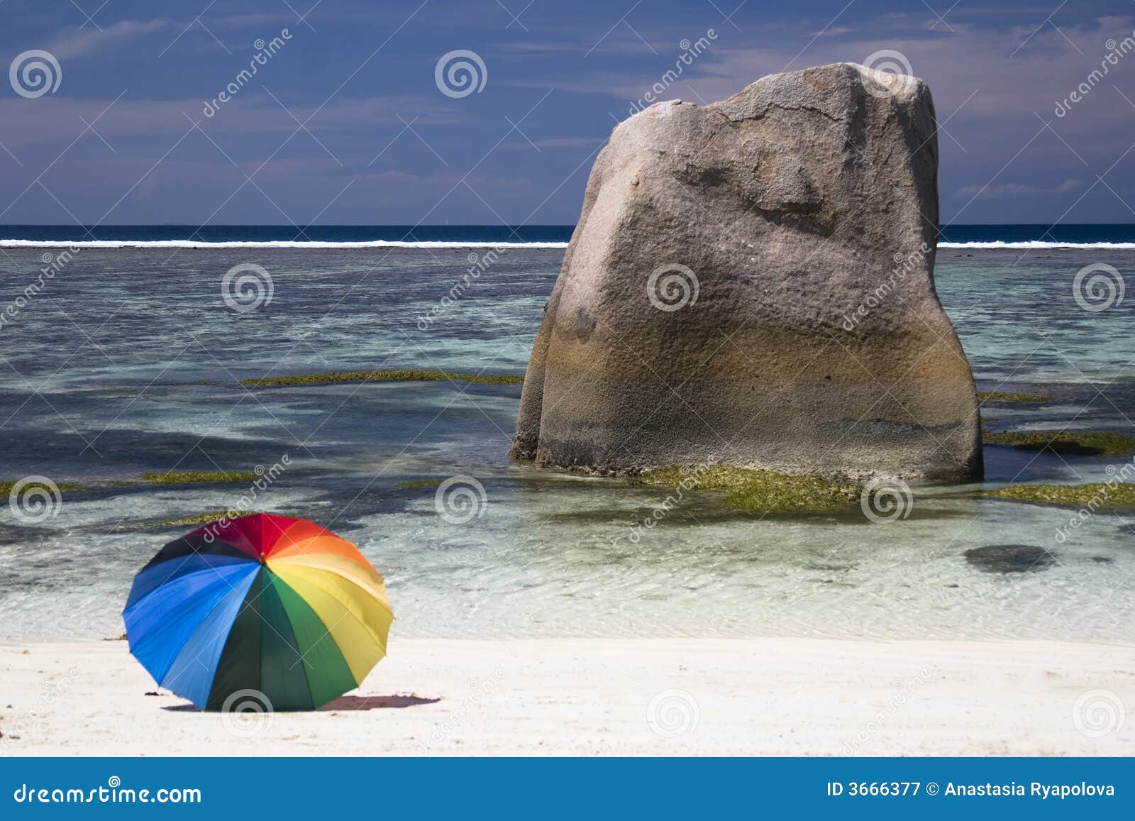 Stone and umbrella stock image. Image of resort, coast - 3666377