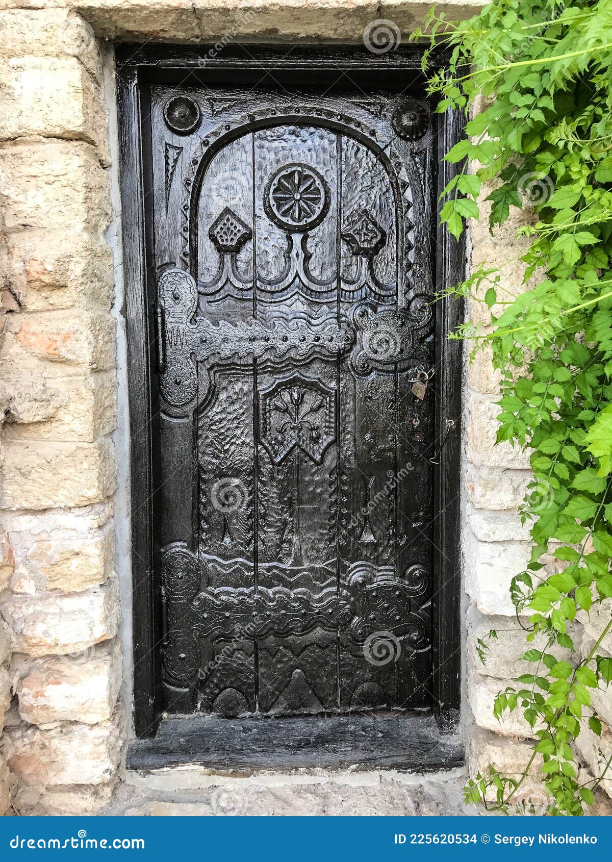 Stone Wall of an Ancient Building with Old Weathered Wooden Gate Stock ...
