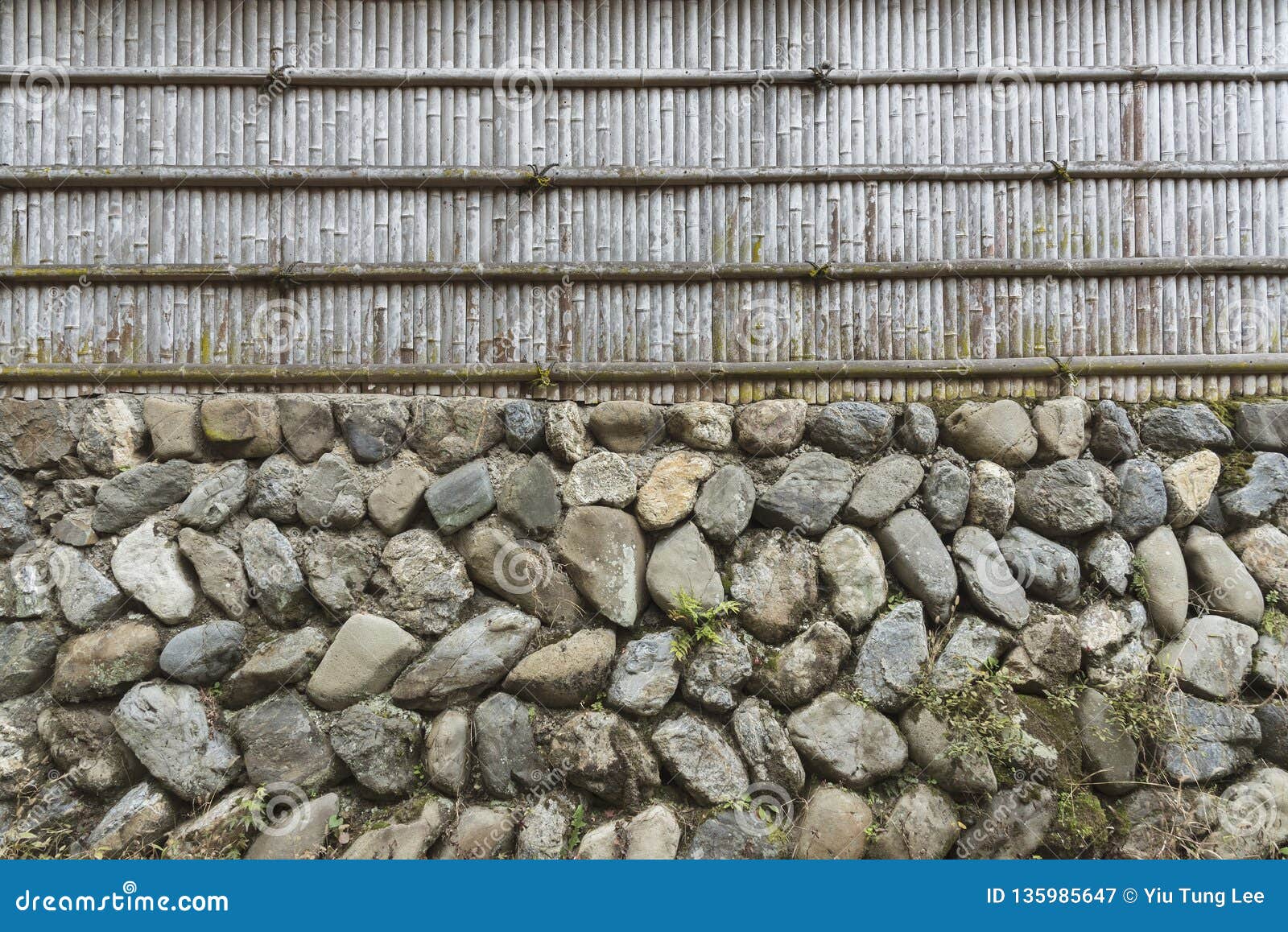 Stone Wall and Bamboo Fence Stock Image - Image of design, construction ...