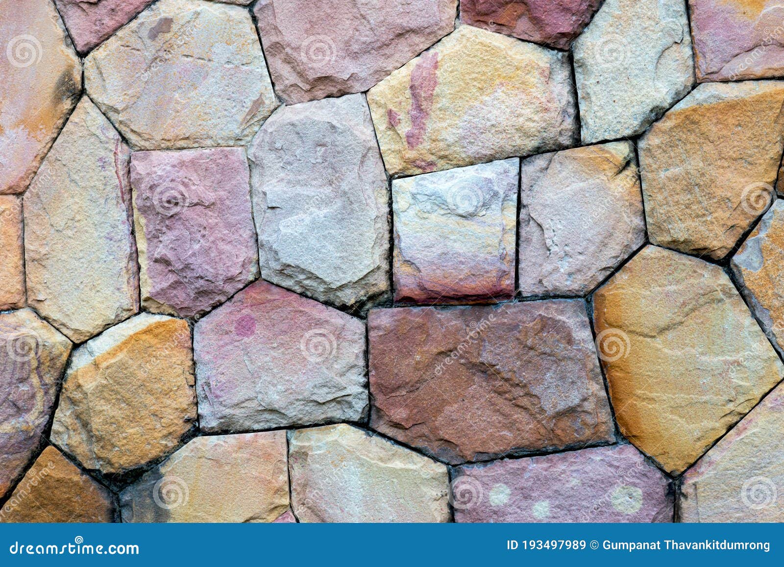 Stone Wall is Built from Beautiful Multi Colored Natural Stones with ...