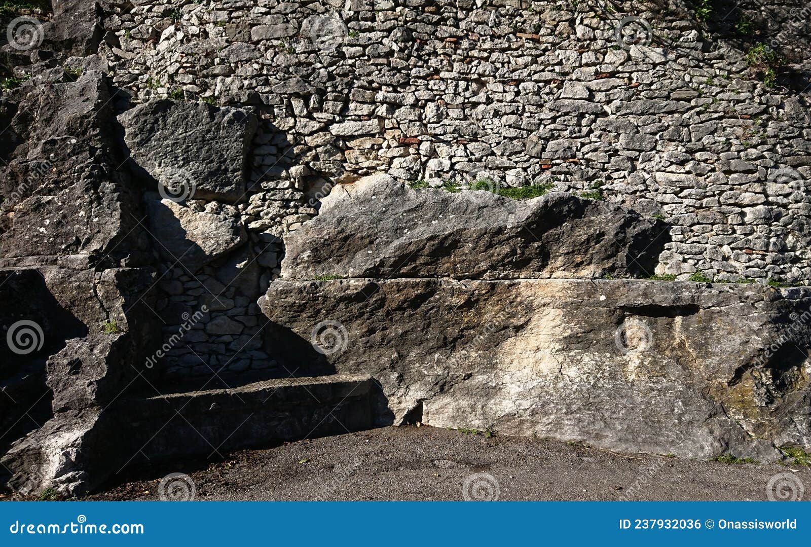 Stone Wall Built into a Rock Face Stock Photo - Image of built, rock ...