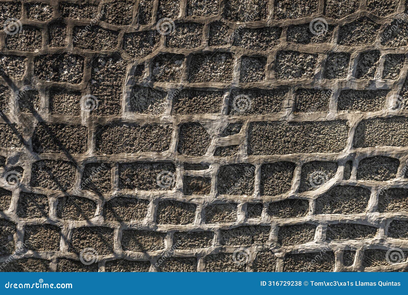 A Stone Wall with Cement Edges Sticking Out Stock Photo - Image of ...