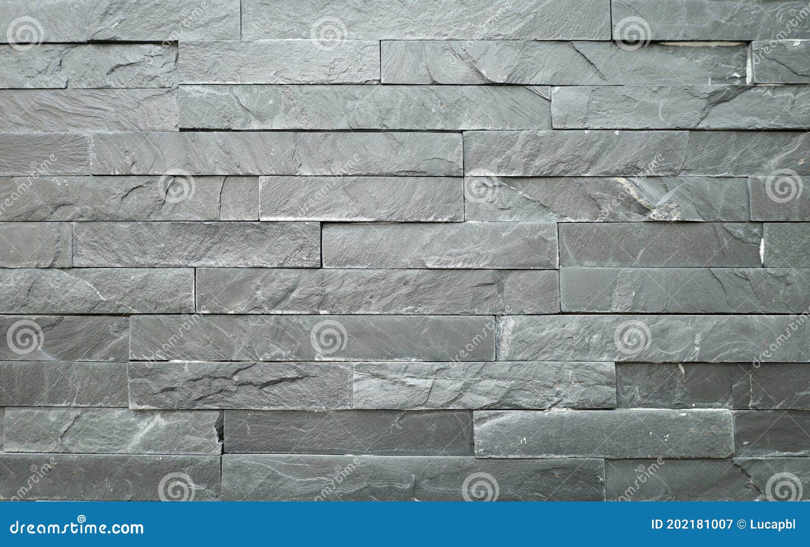 Stone Wall Cladding Made of Horizontal Gray Bricks of Natural Rock ...