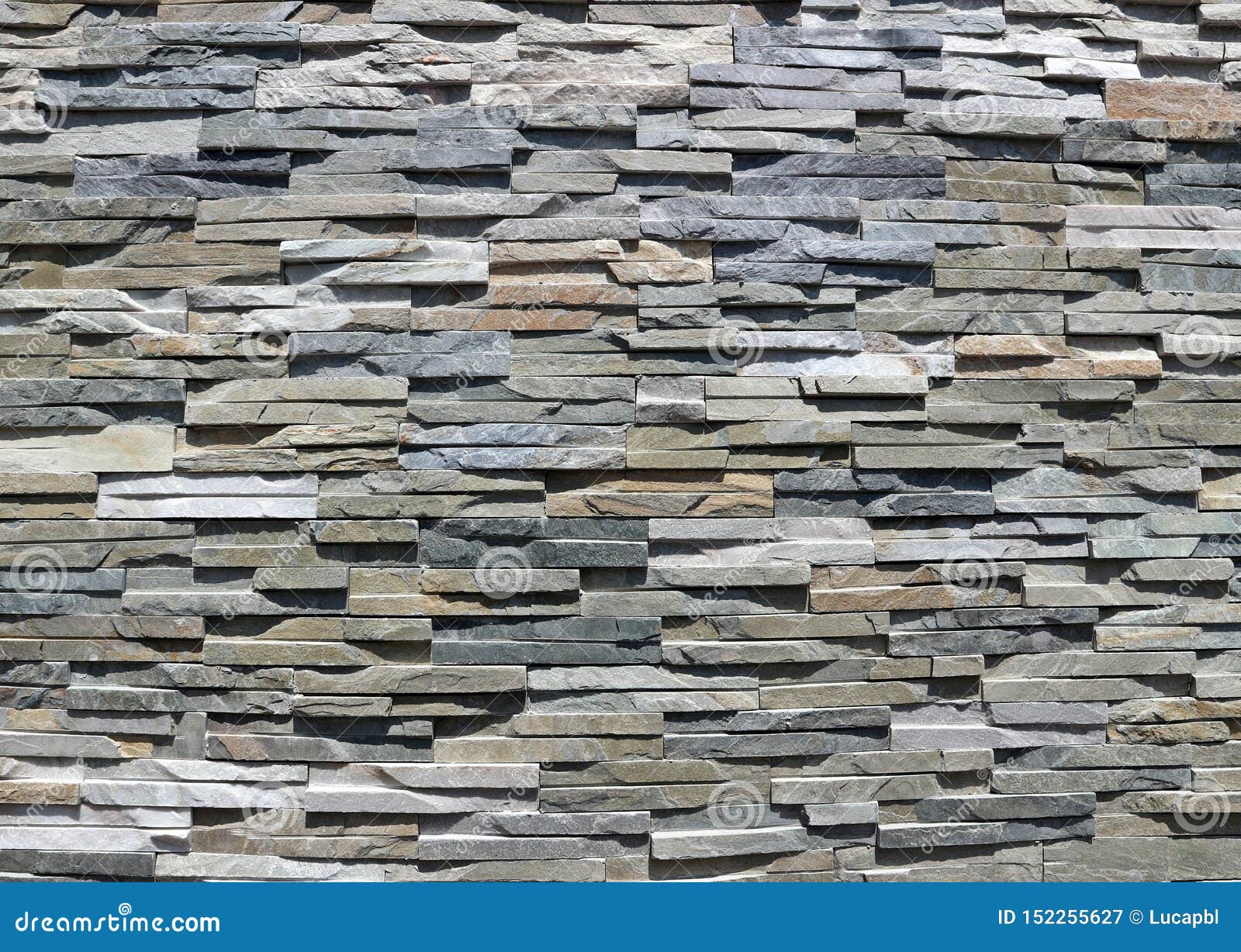 Stone Wall Cladding Made of Uneven Natural Rock Strips of Different ...