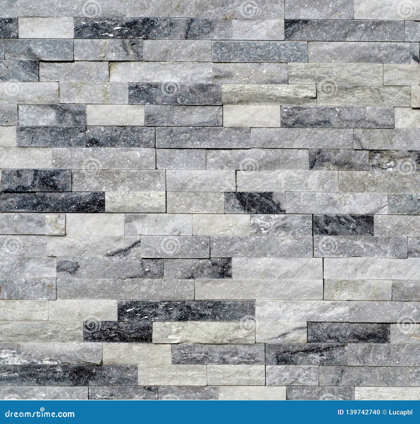 Stone Wall Cladding Made of White and Gray Quartzite Bricks Stock Photo ...