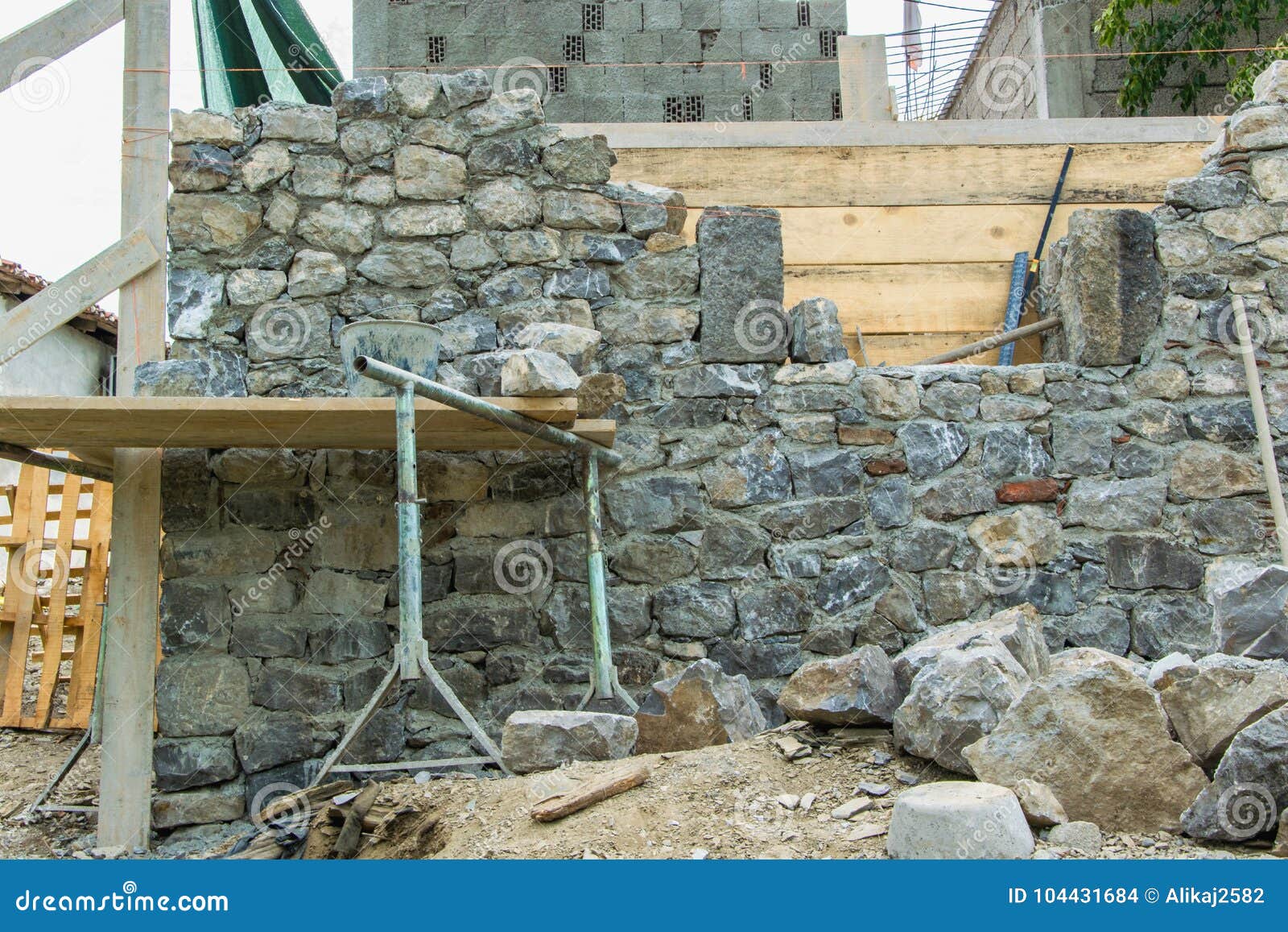 Stone Wall during Construction and Masonry Tools Stock Photo - Image of ...