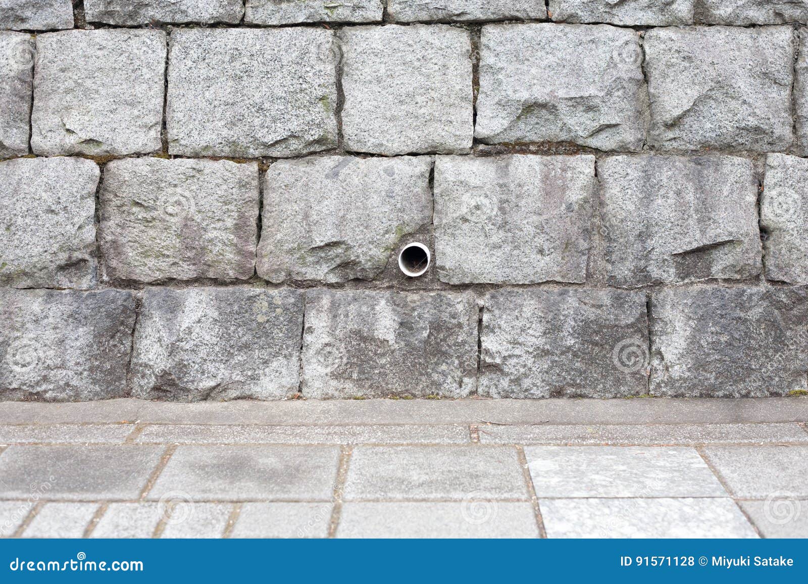 Stone wall and drain pipe stock photo. Image of floor - 91571128