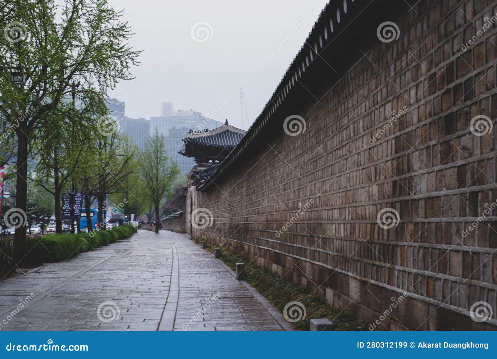 Stone Wall and Footpath Alongside a Street Stock Image - Image of brick ...