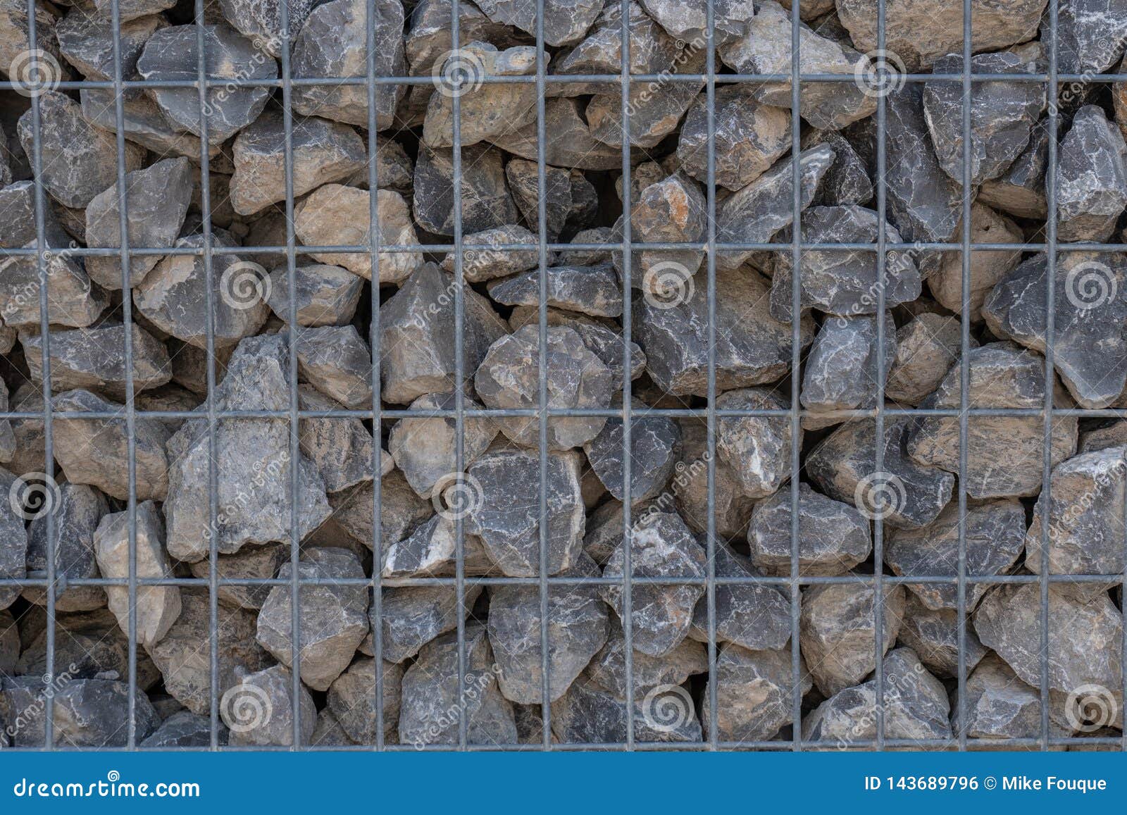 Stone Wall Held by a Metal Grid Stock Photo - Image of rocks, solid ...