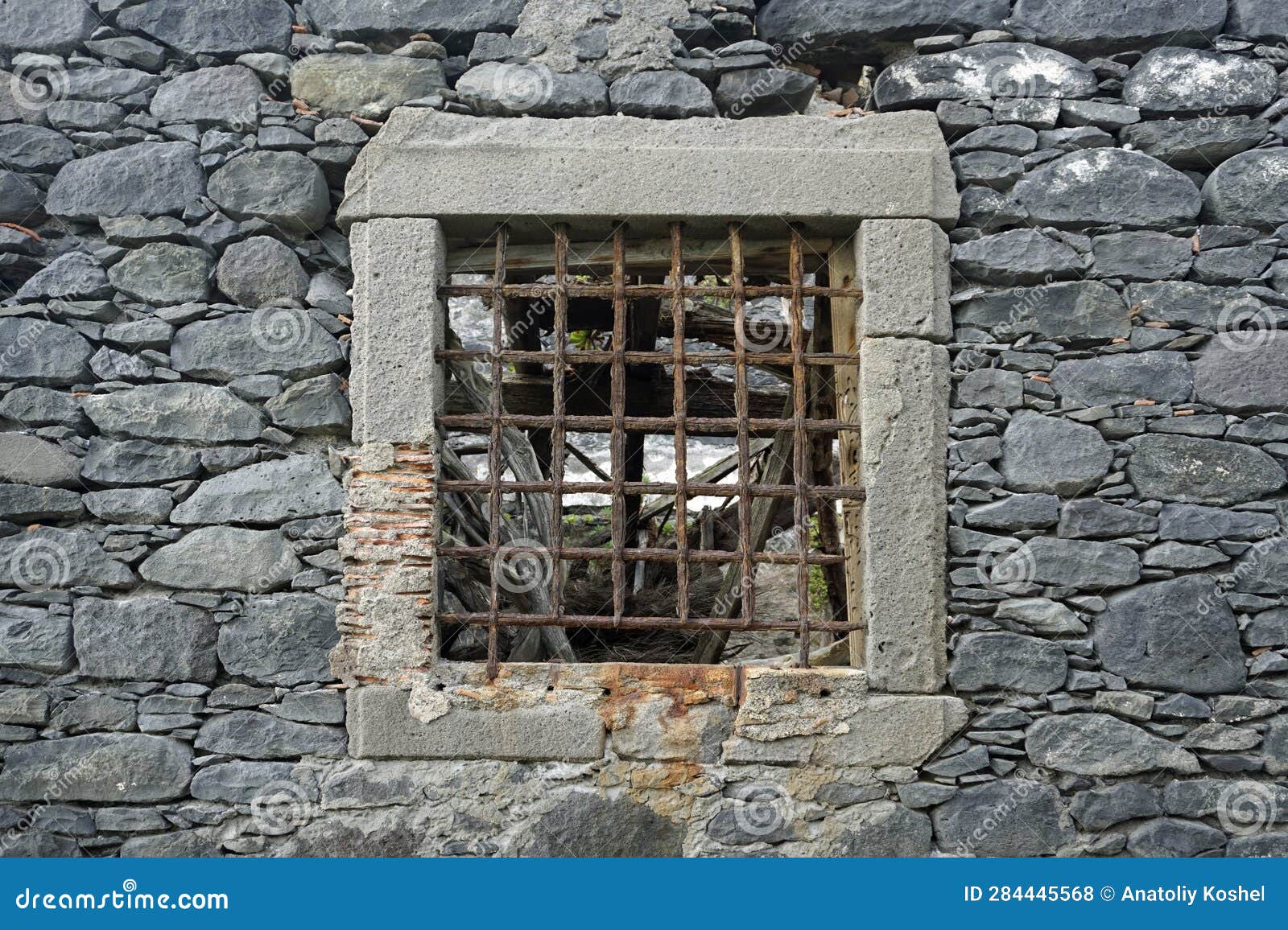 Stone Wall House with Collapsed Roof. Window with Rusty Bars and Light ...