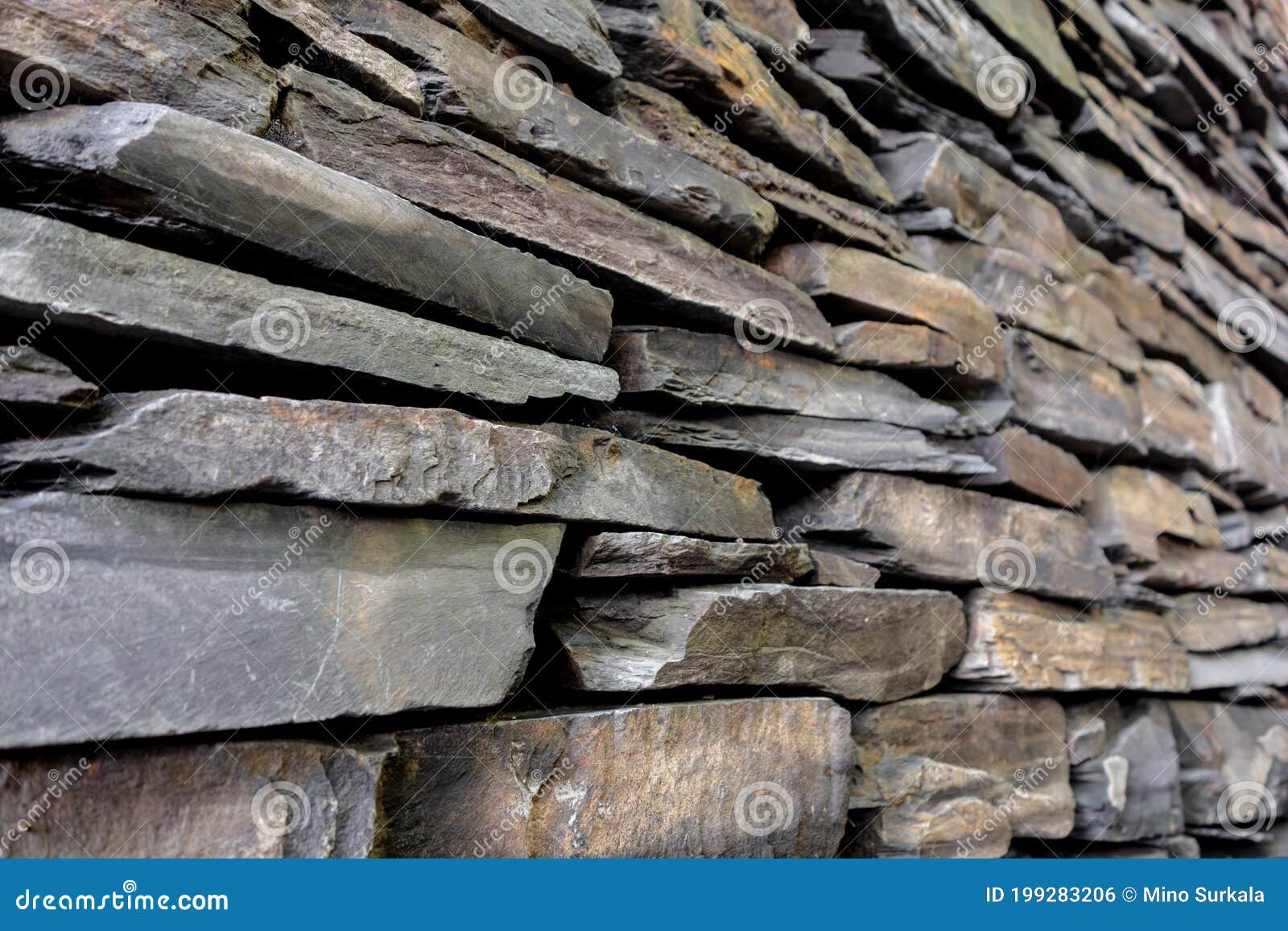 The Stone Wall Made of Slate Bricks Which is Very Rough Material Stock ...