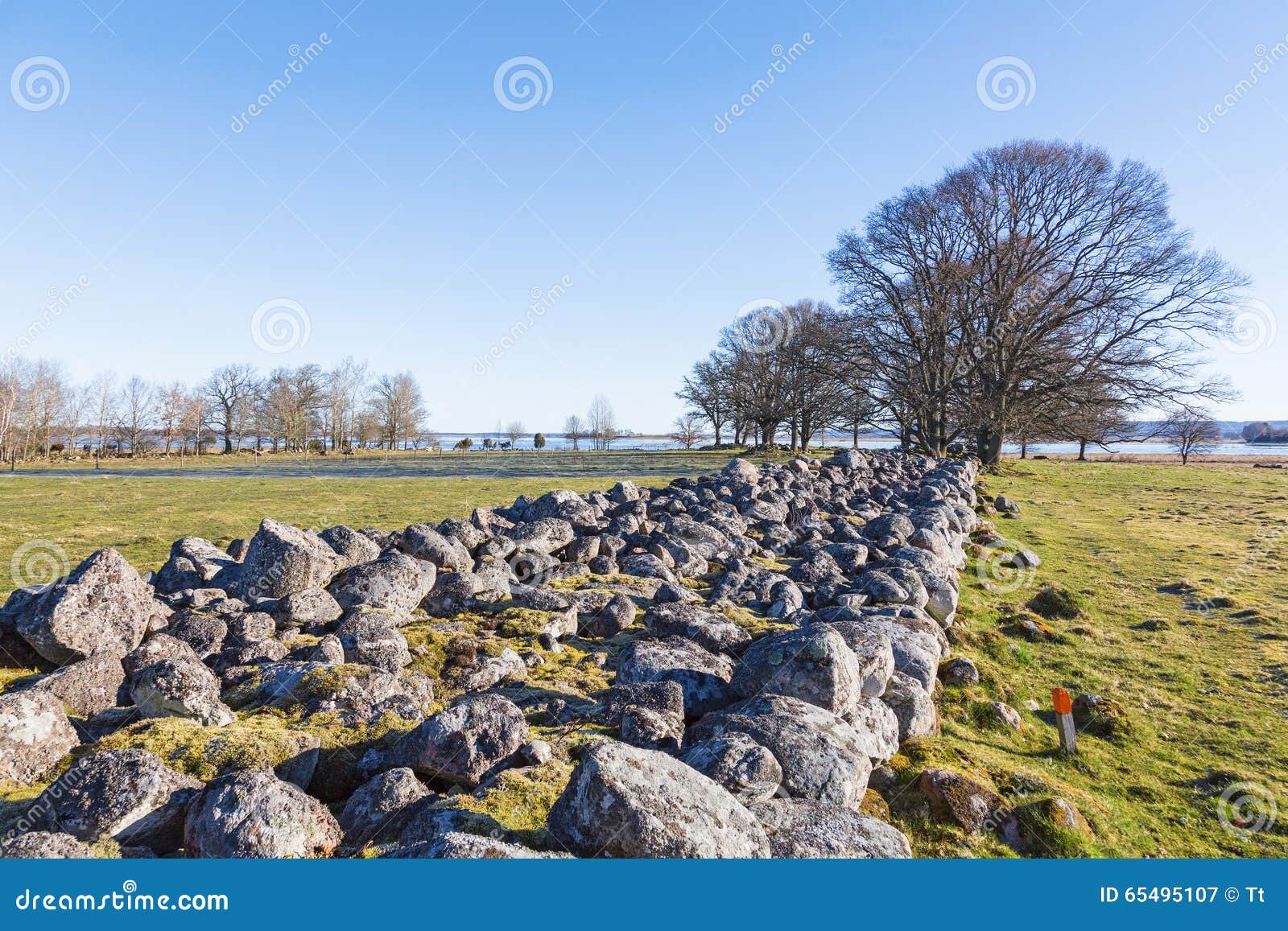 Stone wall on the meadow stock image. Image of land, countryside - 65495107
