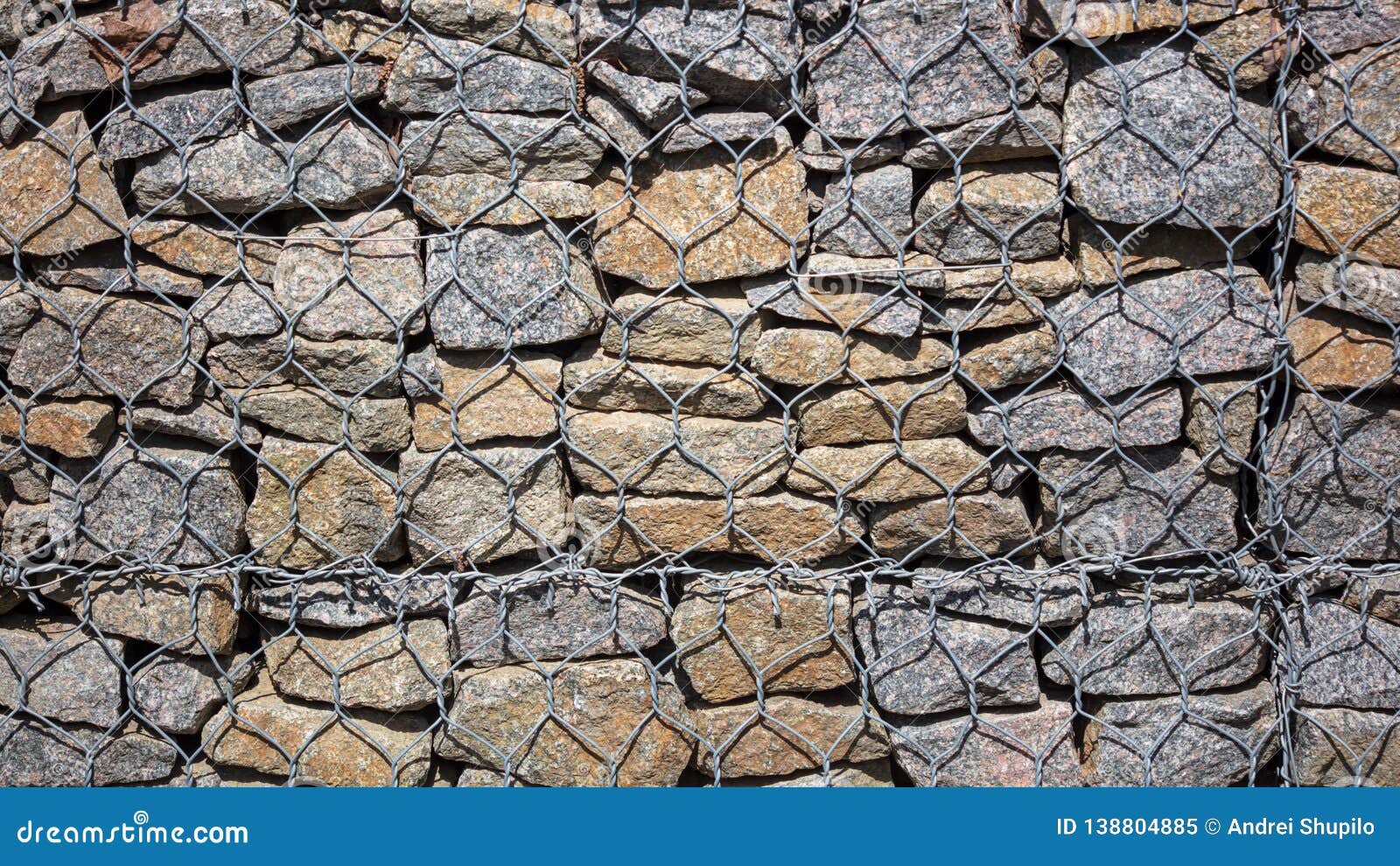 Stone Wall in a Metal Grid As a Background Stock Image - Image of ...