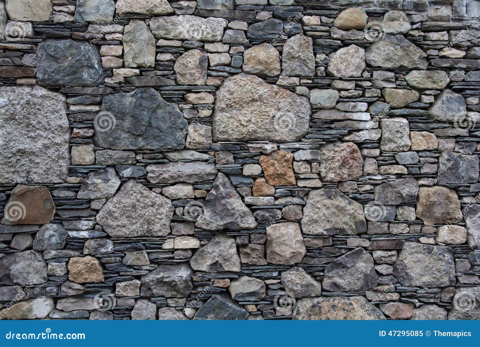 A Wall Of Stone Of Various Shapes And Dark Colors Stock Image ...