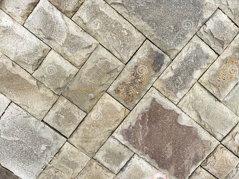 A Stone Wall with a Pattern of Squares and Triangles Stock Photo ...