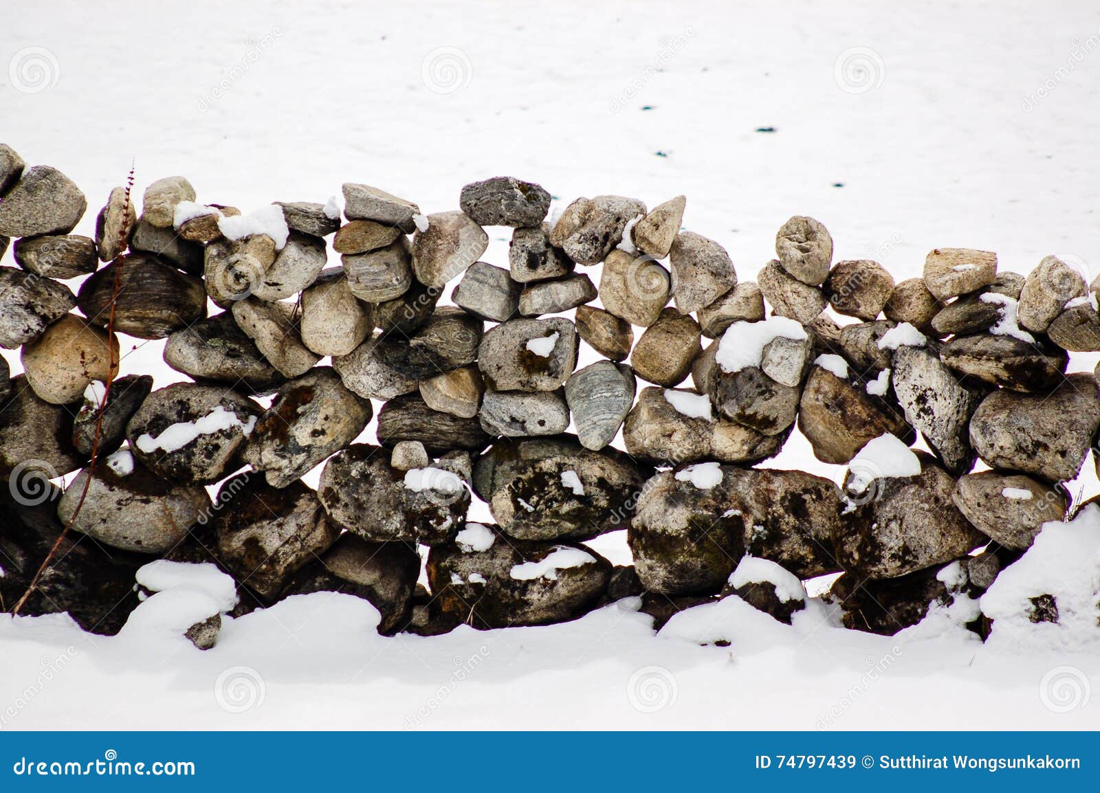 Stone Wall on Snow-covered Ground Stock Image - Image of hard, rock ...