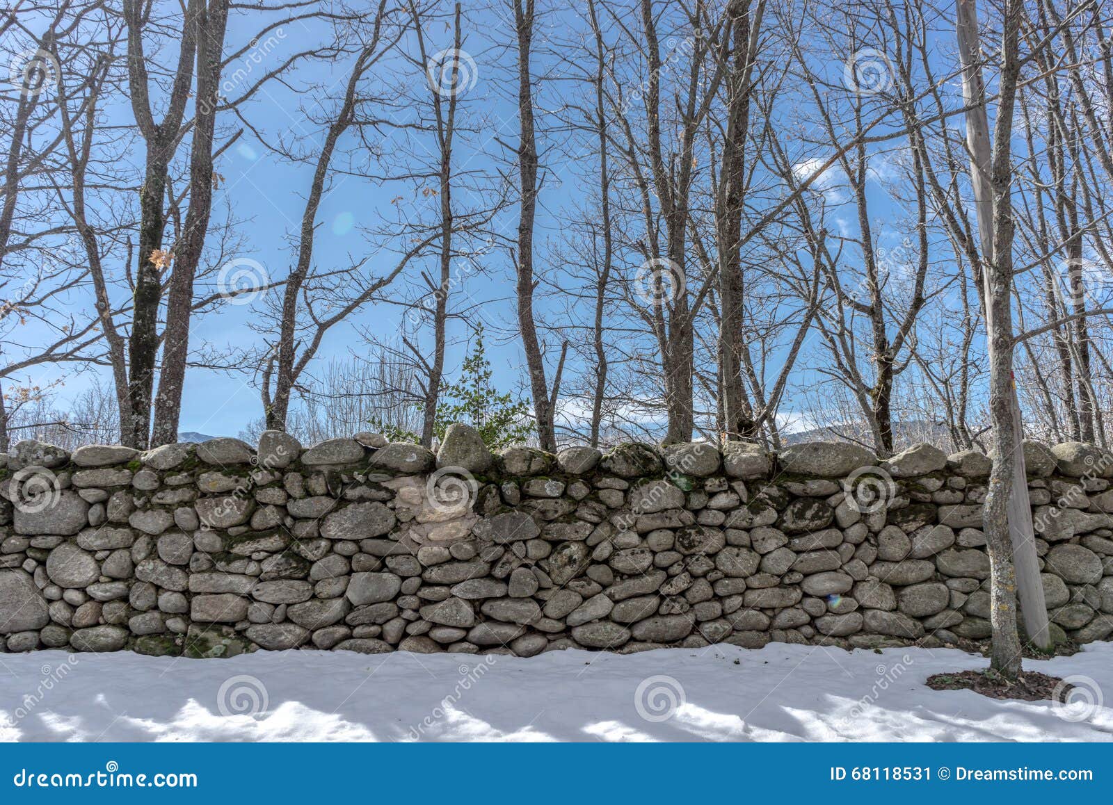 Stone wall in snow stock image. Image of rural, winter - 68118531