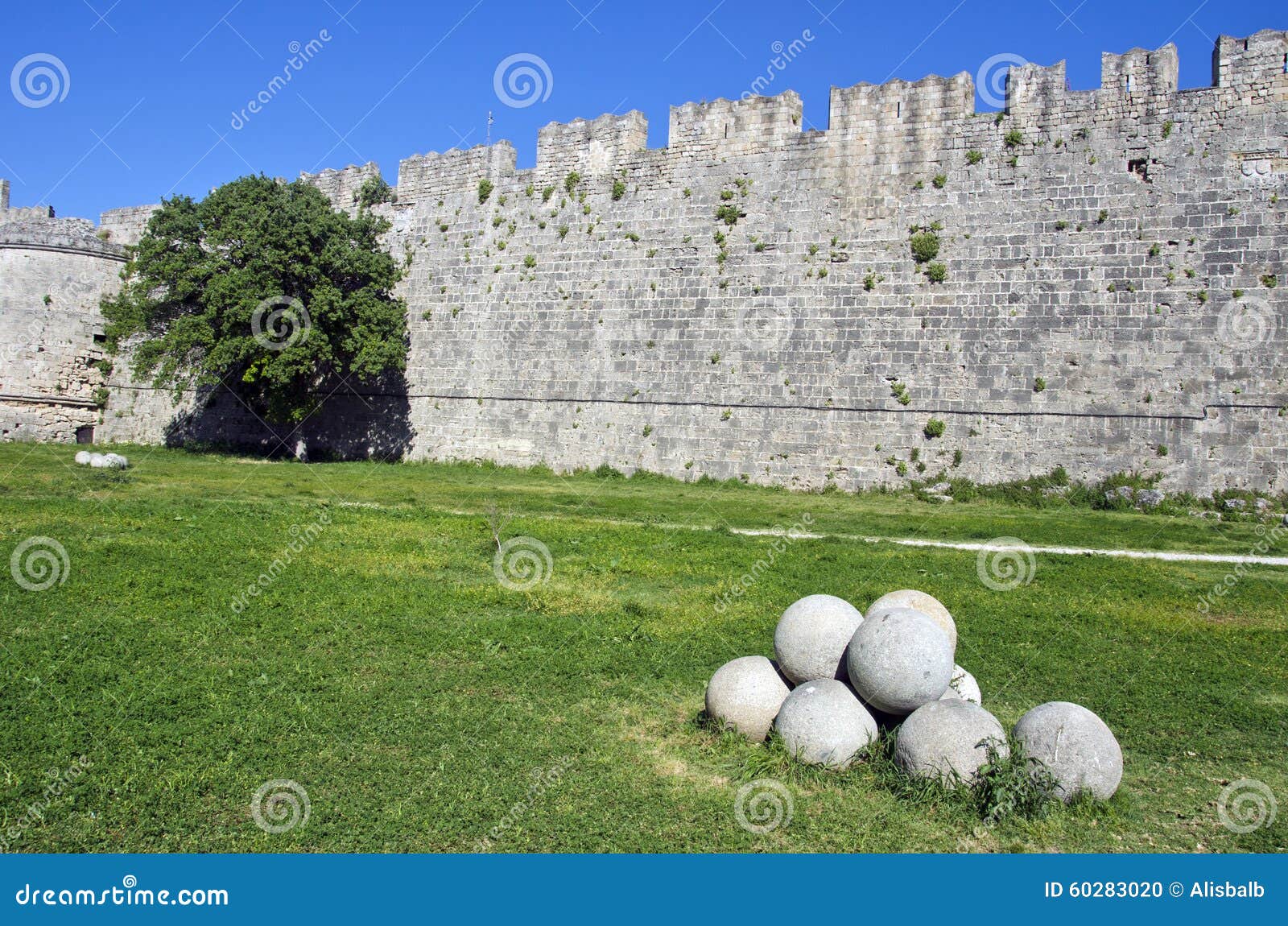 Stone Wall, Tree and Pile Round Stone Objects in Greece Stock Photo ...