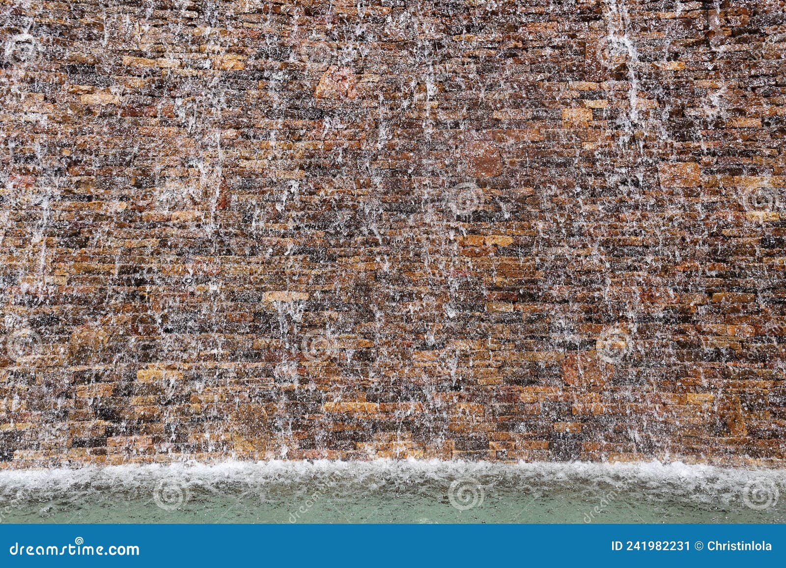 Stone Wall with Water Falling Down it into Fountain Stock Image - Image ...