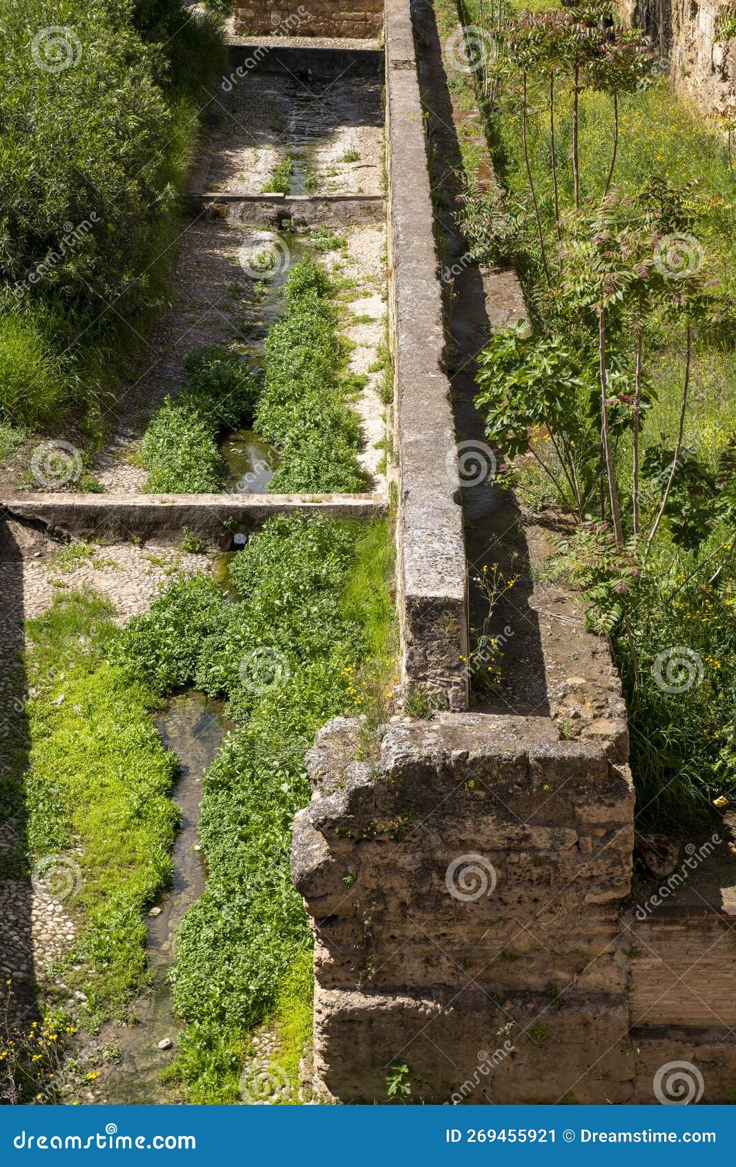 Stone Walls, Stream and Stone Ditch between Grass and Wild Plants Stock ...