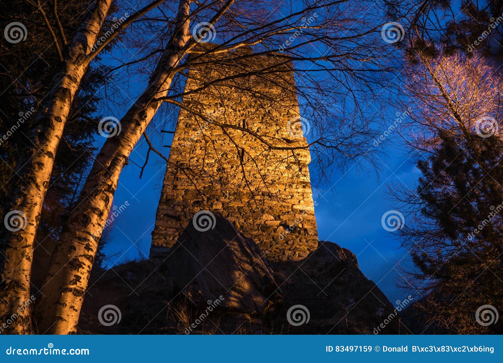 Stone watchtower at night stock image. Image of nightscene - 83497159