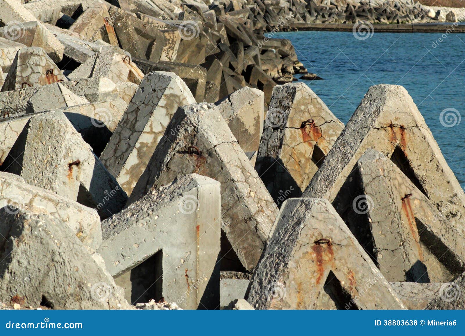Stone wave breaker and sea stock photo. Image of trap - 38803638