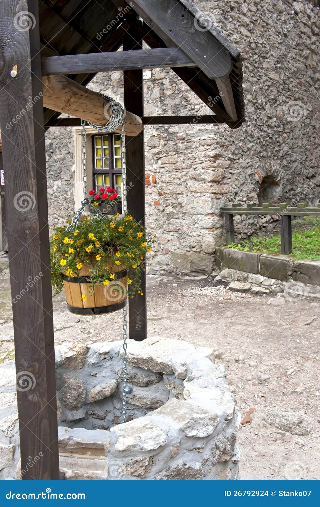Old Stone Well In Traditional House Garden With A Niece And Flowers ...