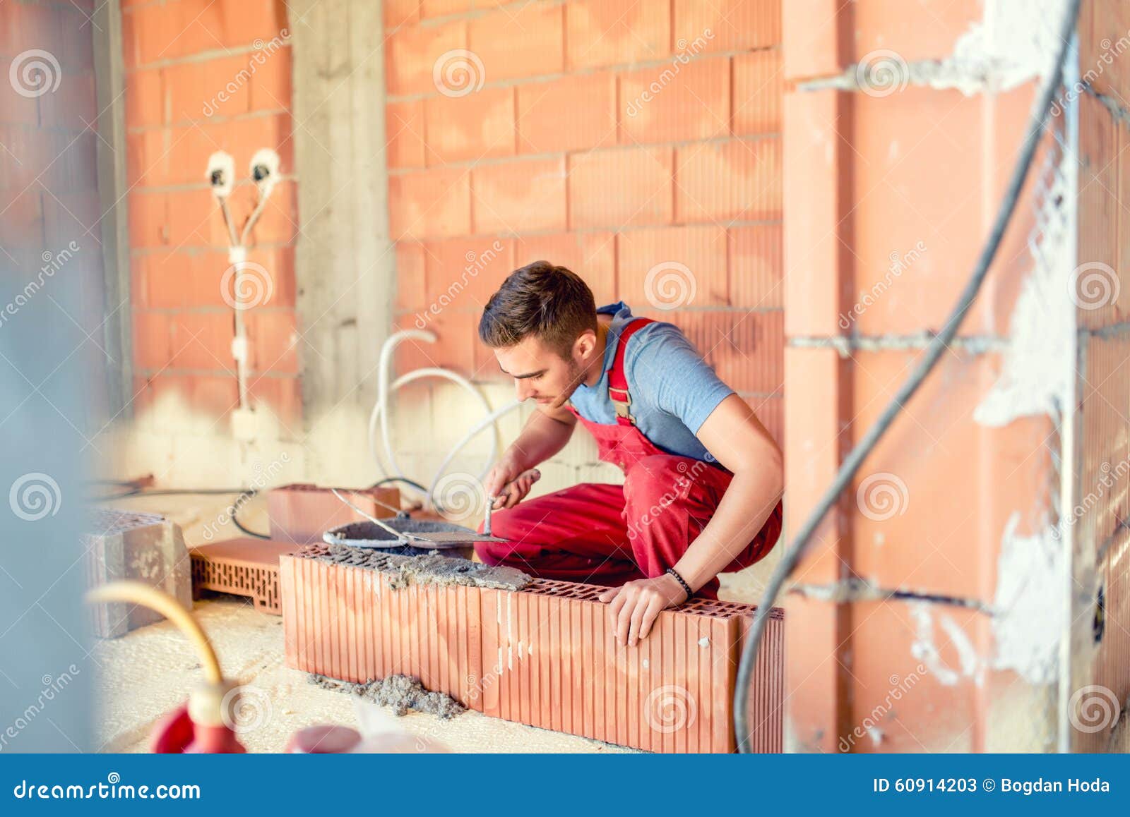 Stonemason Building Walls, Construction Engineer and Worker on Site ...