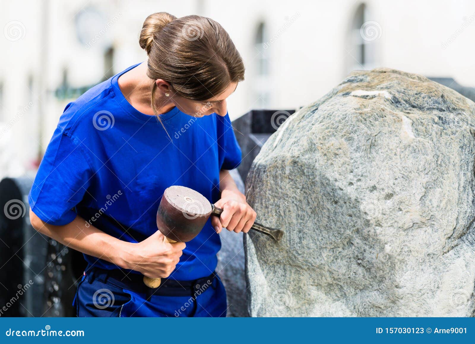 Stonemason Working on Boulder with Sledgehammer and Iron Stock Image ...