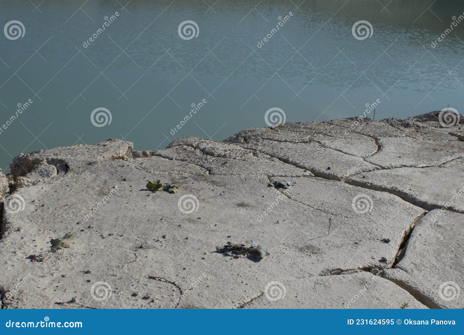 Stones on the Background of a Blue Lake Stock Image - Image of snow ...