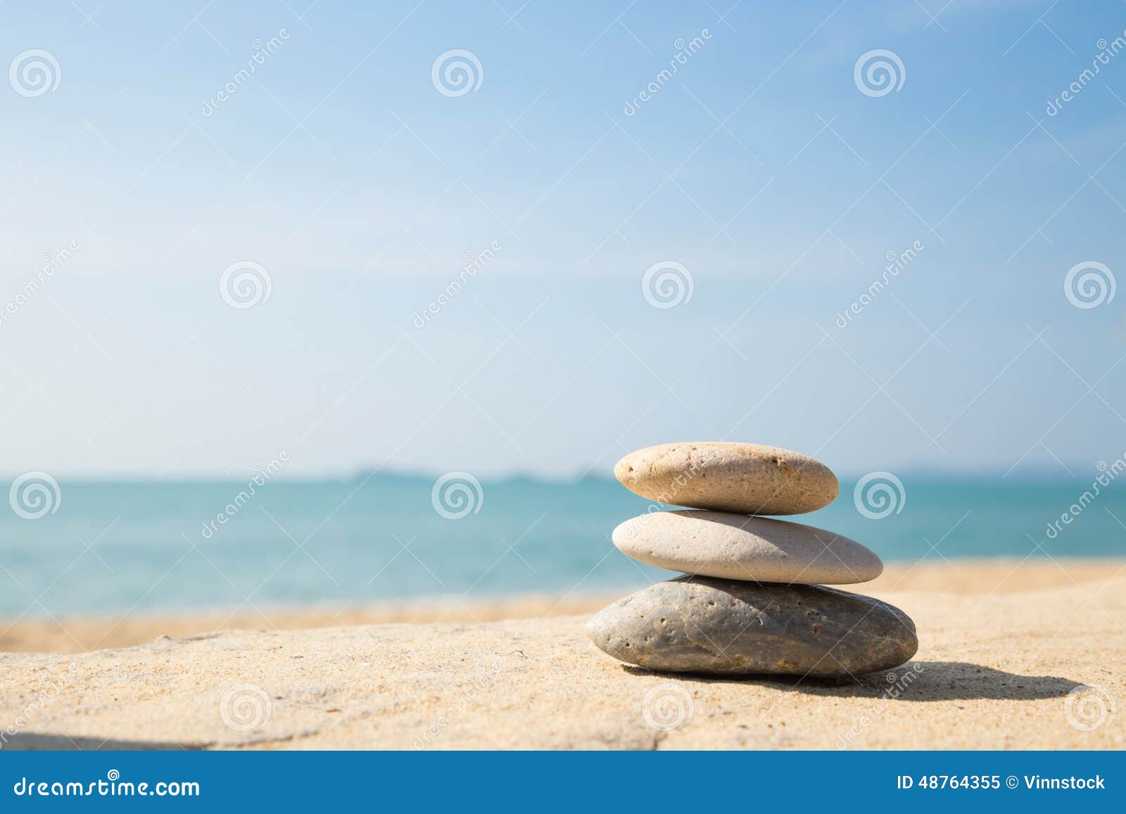 Balance Pebbles And Couple Legs On The Beach Royalty-Free Stock ...