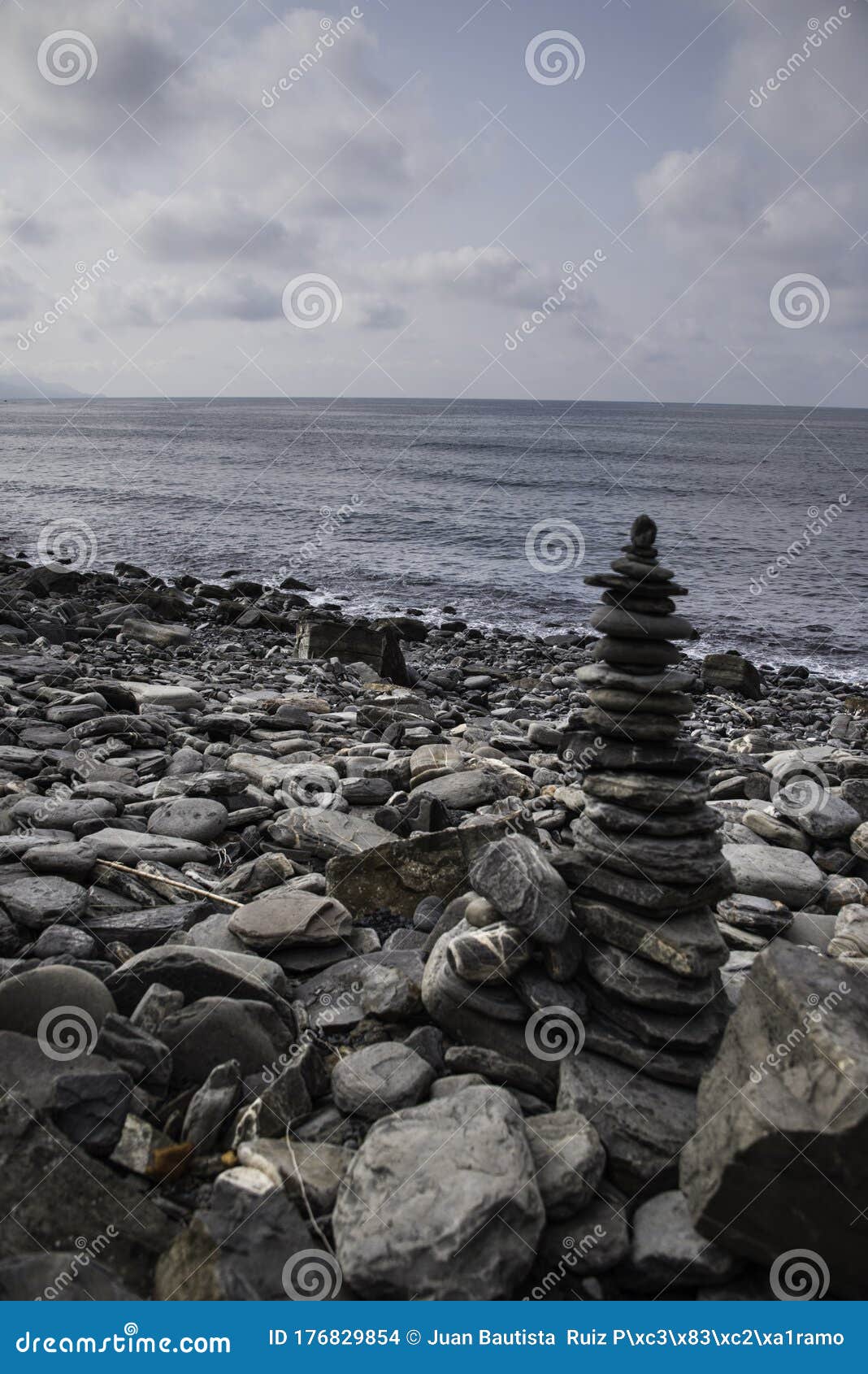 Stones on the beach stock photo. Image of ocean, horizon - 176829854